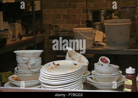 Dirty dishes piled up in the kitchen sink Stock Photo: 15320380 - Alamy