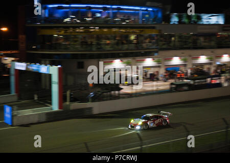 Nuerburgring, race track at night, Porsche 911 GT3 R, passing pit lane ...