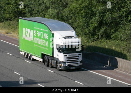 Asda supermarket delivery lorry and trailer overtaking a similar ...