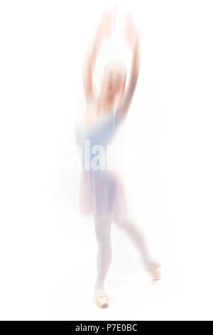 Blurred young ballet dancer posing on white background Stock Photo - Alamy