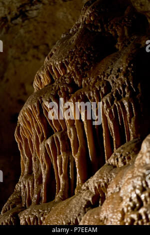 Sheets of flowstone covering the walls of the cave of the Mounds, a ...