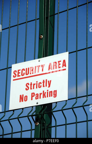 Perimeter security fencing with anti climb spikes and warning signs ...