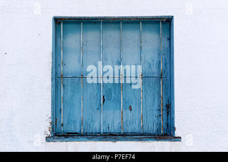 Blue barred square window against a white wall Stock Photo - Alamy