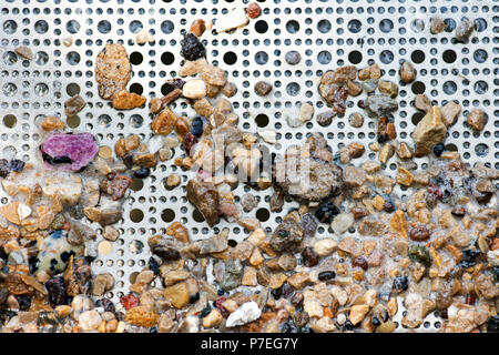 Gemstone panning with a sluice box. Sifting for stones and fossils at ...