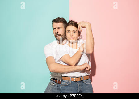 The squint eyed woman with weird expression isolated on blue Stock ...