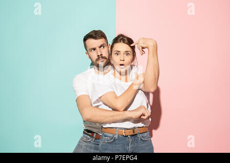 The squint eyed woman with weird expression isolated on blue Stock ...