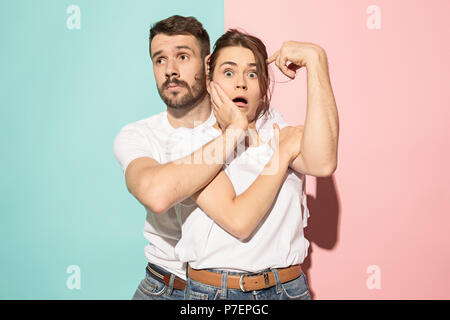 The squint eyed woman with weird expression isolated on blue Stock ...