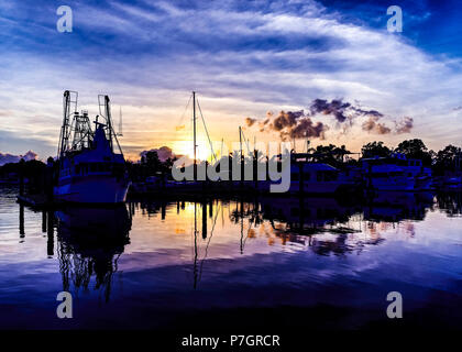 Lilac sunset over the sea with a boat in the distance. Sea evening ...
