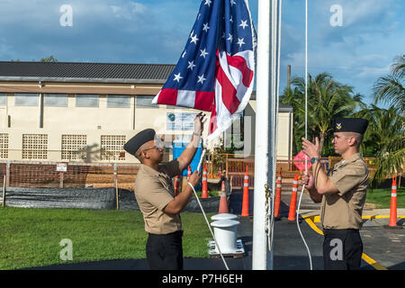 SANTA RITA, Guam (July 1, 2018) Sailors hoist the 30th Naval ...