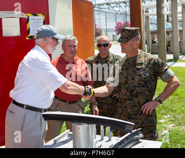U.S. Marine Brig. Gen. Karsten S. Heckl watches a product demonstration ...