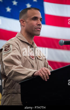 Brig. Gen. Adrian Spain, 380th wing commander, salutes during a retreat ...