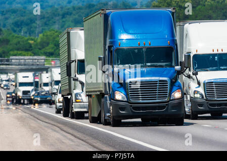 Long line of trucks driving on the A16 E19 road from Antwerp into the ...