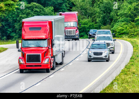 Semi Trucks 18 wheelers and cars on multiple lane highway Stock Photo ...