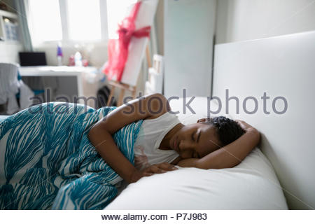 Girl tired of sleeping in bed Stock Photo - Alamy