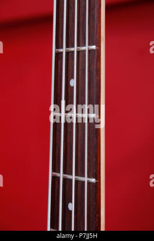 Head and neck of bass guitar Stock Photo - Alamy