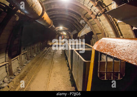 Mine with railroad track - underground mining Stock Photo - Alamy