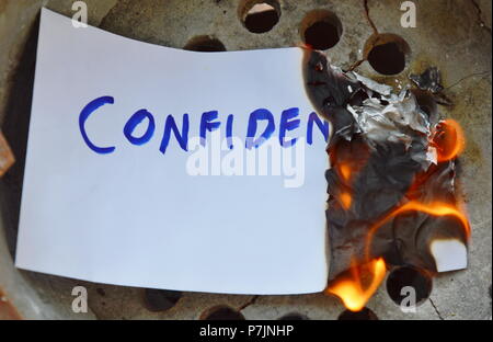 envelope burn on clay stove Stock Photo - Alamy