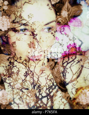 Portrait of a woman overlaid with branches and flowers Stock Photo - Alamy