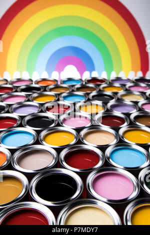Rainbow colors, Open cans of paint Stock Photo - Alamy