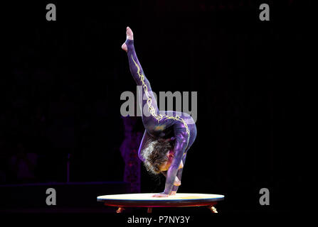 Acrobat (caoutchouc) baby girl performing on the ring of the circus ...