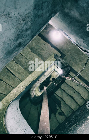 Dangerous spiral stairs in an eroded old building used by a social ...