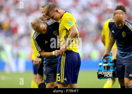 Sweden's Emil Krafth receives medical attention whilst team mates Albin ...