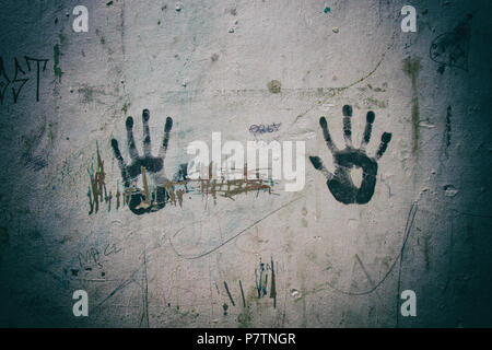 Right and Left hand print marks on a shabby wall Stock Photo - Alamy