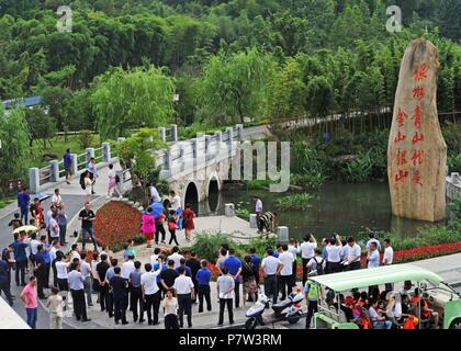 Anji, China's Zhejiang Province. 7th July, 2018. Tourists ride a train ...