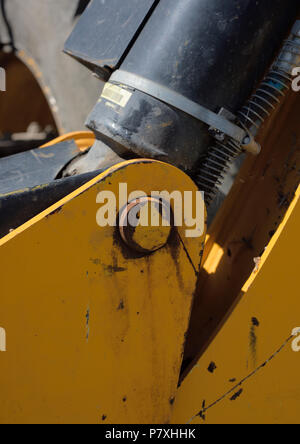 Hydraulic ram pivot point and clevis pin on telehandler Stock Photo - Alamy