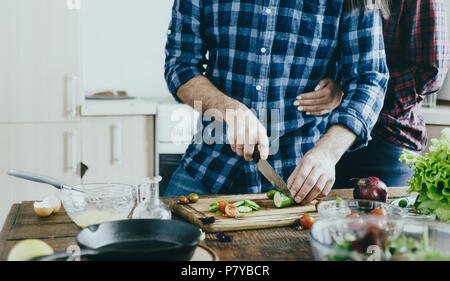 Couple cooking breakfast from vegetables at home in the kitchen Stock ...
