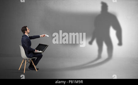 Humble businessman staying and offering stuffs to a superhero shadow ...