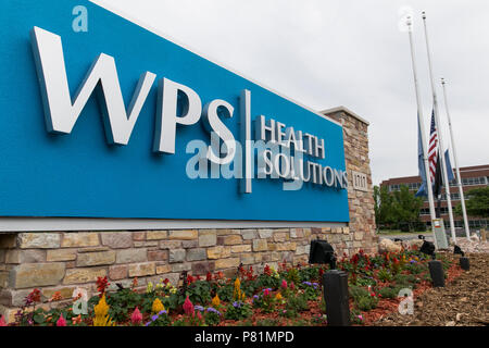 A logo sign outside of the headquarters of WPS Health Solutions in ...