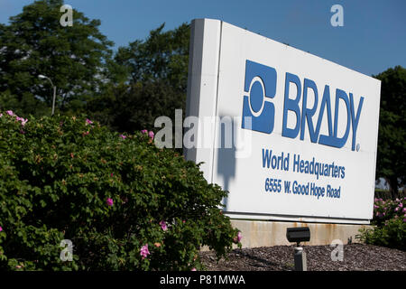 A logo sign outside of the headquarters of the Brady Corporation in ...