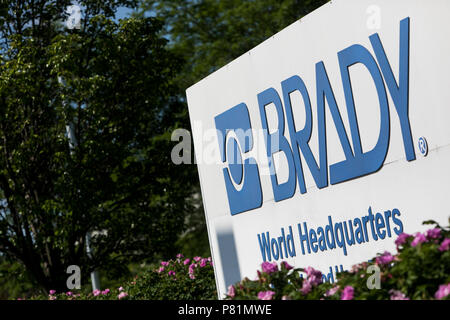 A logo sign outside of the headquarters of the Brady Corporation in ...
