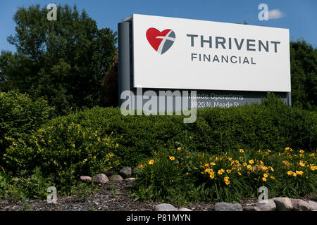 A logo sign outside of the headquarters of Thrivent Financial in ...