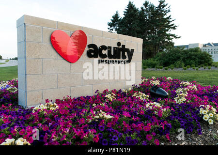 A logo sign outside of the headquarters of Acuity Insurance in ...