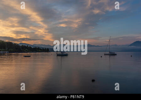 Colorful sunrise on the marina of Lausanne on the Lake Leman in summer ...