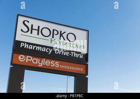 A logo sign outside of a Shopko Hometown retail store in Kiel ...