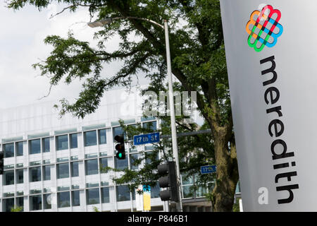 A logo sign outside of the headquarters of the Meredith Corporation in ...