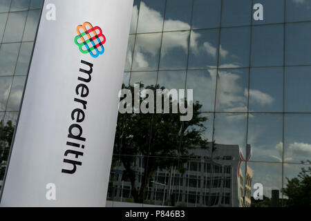 A logo sign outside of the headquarters of the Meredith Corporation in ...
