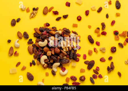 Dried fruits and assorted nuts on a white wooden table Stock Photo - Alamy