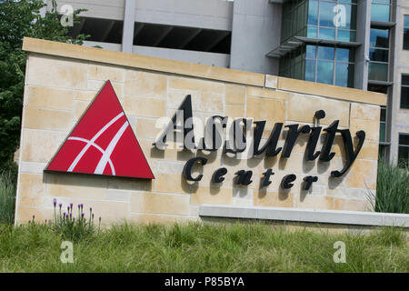 A logo sign outside of the headquarters of the Assurity Life Insurance ...