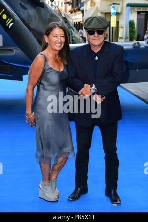 Brenda Johnson and Brian Johnson attending the premiere of Spitfire ...