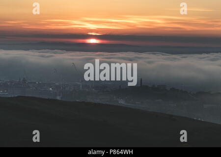 Sea mist (haar) engulfing Edinburgh, the capital of Scotland, shortly ...