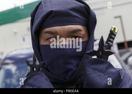 July 9, 2018 - Yokohama, Japan - A Sanwa Koutsu Group taxi driver ...