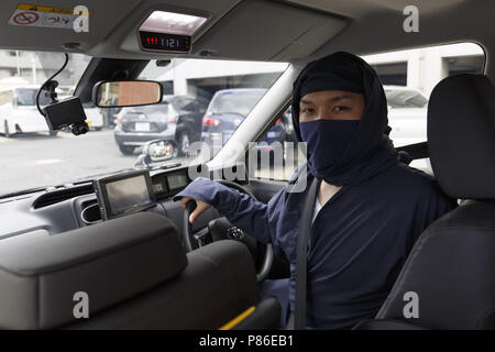 July 9, 2018 - Yokohama, Japan - A Sanwa Koutsu Group taxi driver ...