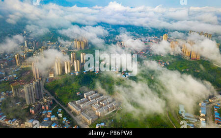 Huaying, Huaying, China. 10th July, 2018. Huaying, CHINA-Mist envelops ...