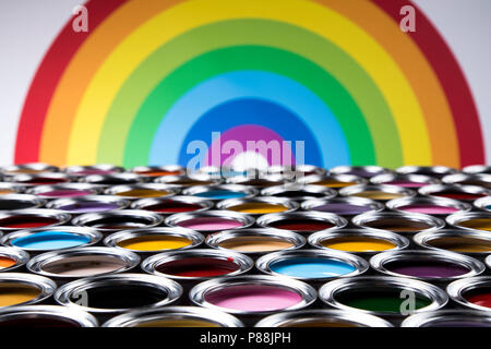 Rainbow, tin metal cans with color paint Stock Photo - Alamy