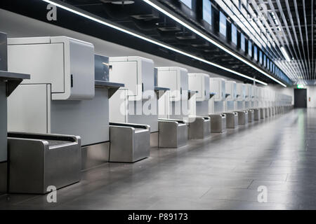 Luggage conveyor at check-in counter of KLIA, Malaysia Stock Photo - Alamy