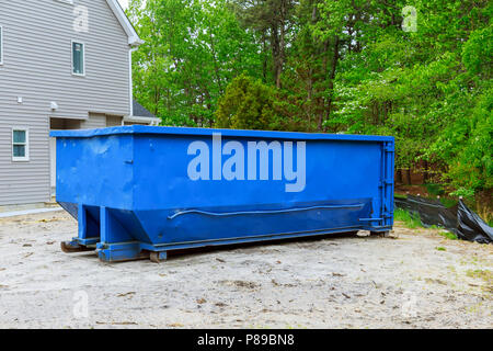 Full construction rubbish bin with loads at construction site waste ...
